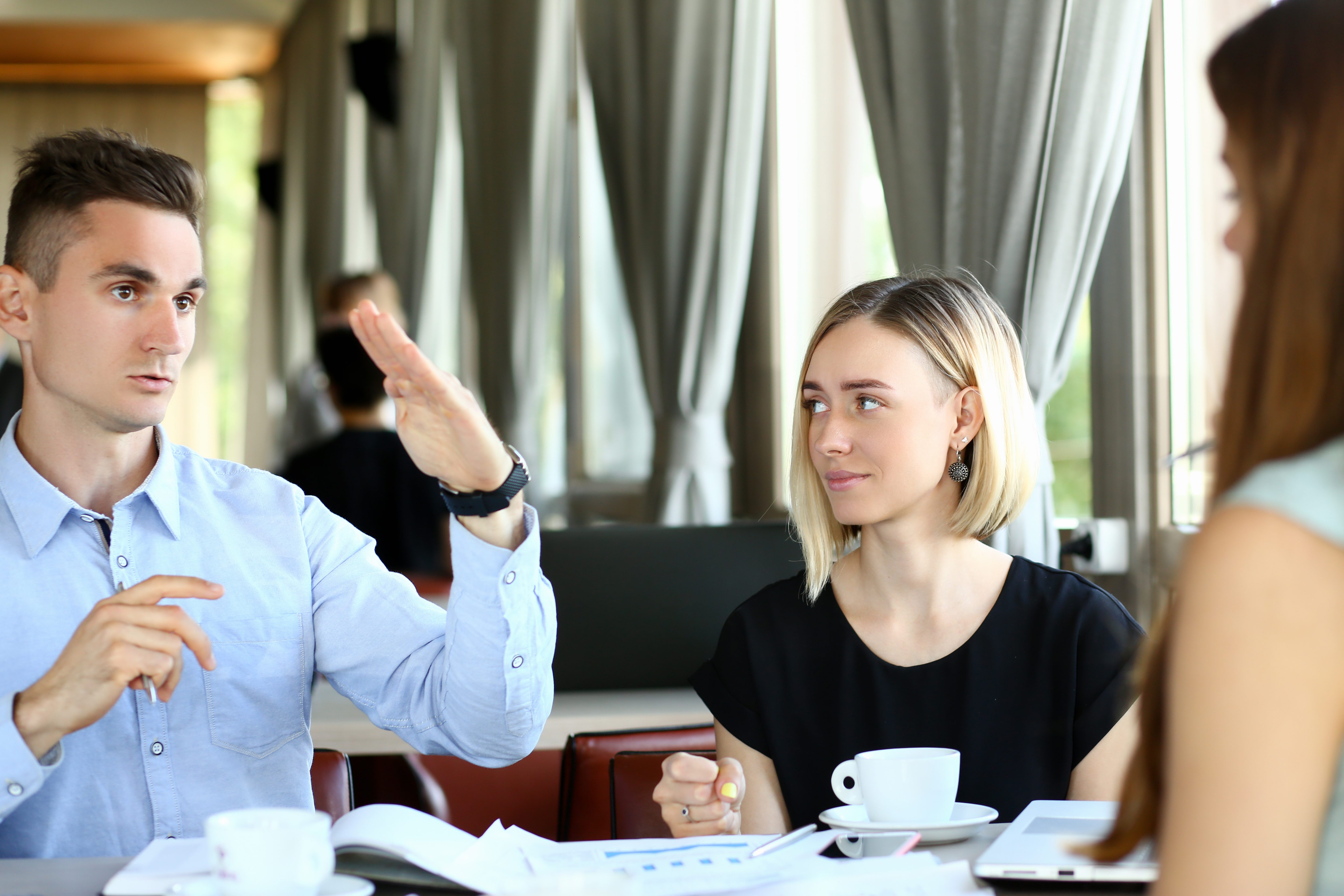 Three millennial people portrait met in cafe - Affordable Language Services